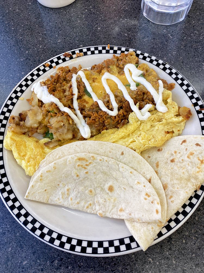Breakfast hash that doesn't mess around&mdash;chorizo, potatoes, and eggs in perfect harmony with a drizzle of sauce that ties it all together like a culinary conductor.