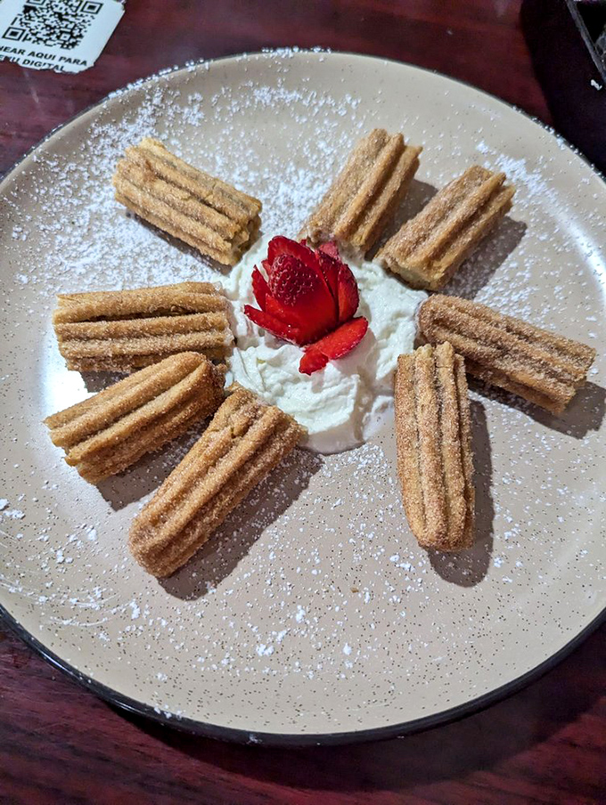 Churros arranged like a sunburst around whipped cream&mdash;proof that geometry can indeed be delicious.