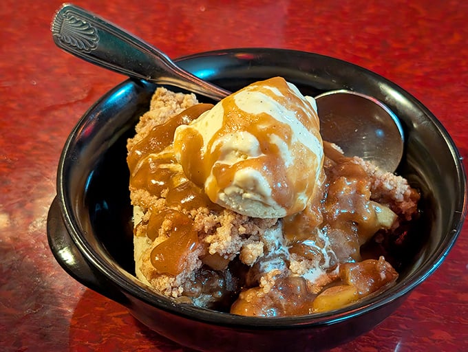 This isn't just dessert, it's emotional closure&mdash;warm cobbler topped with ice cream melting into a sweet symphony that demands to be savored slowly.