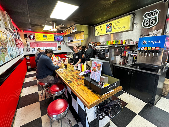 Counter seating: where solo diners become part of the family. Watch the grill masters work their magic while perched on these classic red stools.