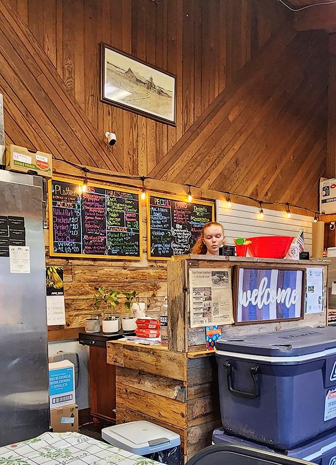 The heart of operations: wooden walls, string lights, and chalkboard menus create the perfect backdrop for barbecue memories in the making.