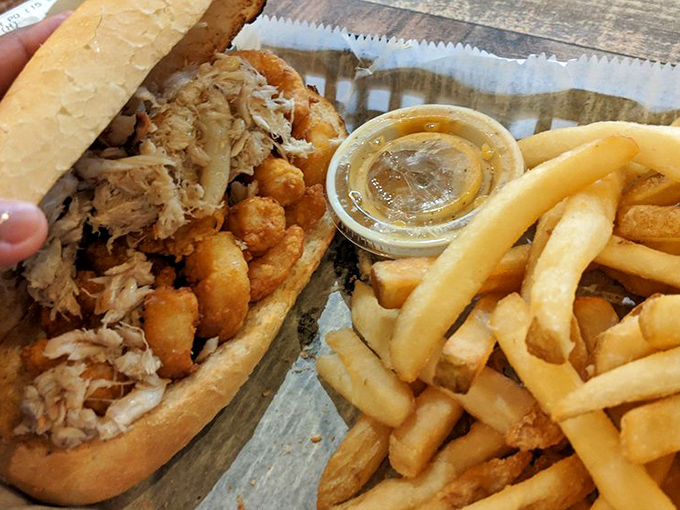 This po' boy is rich with flavor—a delicious contradiction wrapped in bread and served with a side of happiness.