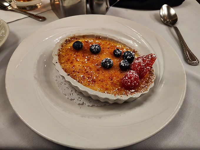 The cr&egrave;me br&ucirc;l&eacute;e's crackling sugar top gives way to silky custard beneath&mdash;the perfect sweet finale to a savory symphony.