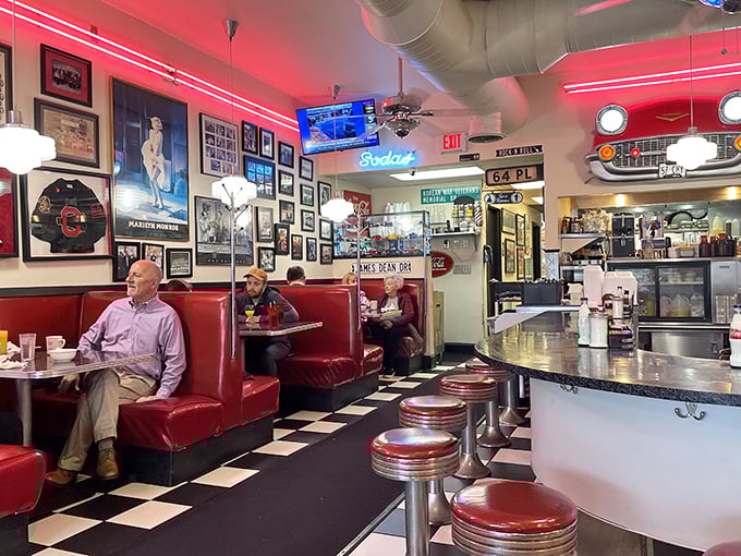 The walls tell stories through memorabilia and photographs, while counter stools await the next chapter in Tommy's ongoing American diner saga.
