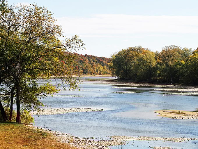 The Des Moines River flows past Bentonsport with the unhurried confidence of someone who knows they've been part of the story for millennia.
