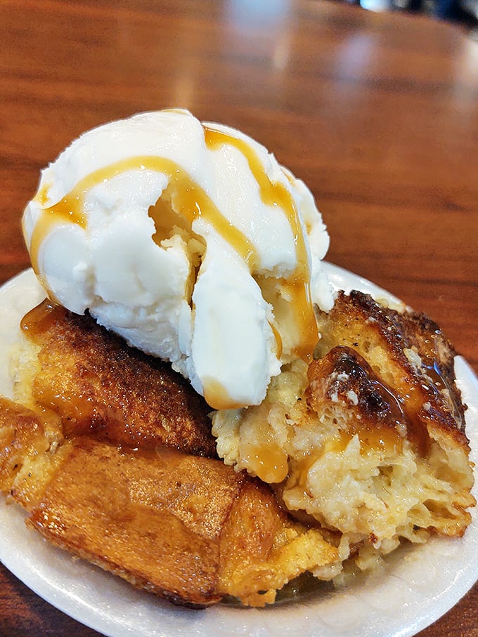 Bread pudding crowned with vanilla ice cream and caramel sauce&mdash;proof that the best relationships are hot, cold, and a little bit sticky.