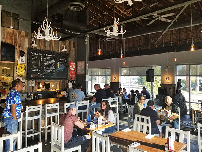 A bustling dining room where strangers become friends united by the universal language of "mmmmm." High ceilings can't contain the flavor happening below.