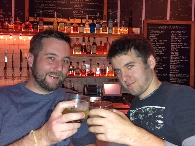 The universal language of "cheers" transcends all barbecue boundaries. These gentlemen understand that good whiskey makes great memories.