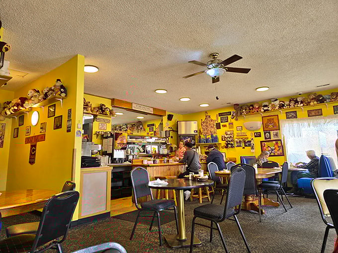 The dining area's yellow walls and wooden tables create the perfect backdrop for breakfast magic. Every bear figurine has witnessed countless pancake revelations.