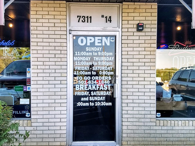 This unassuming entrance has welcomed hungry patrons for decades. Behind that simple door with posted hours lies a world of culinary comfort that keeps North Little Rock coming back.