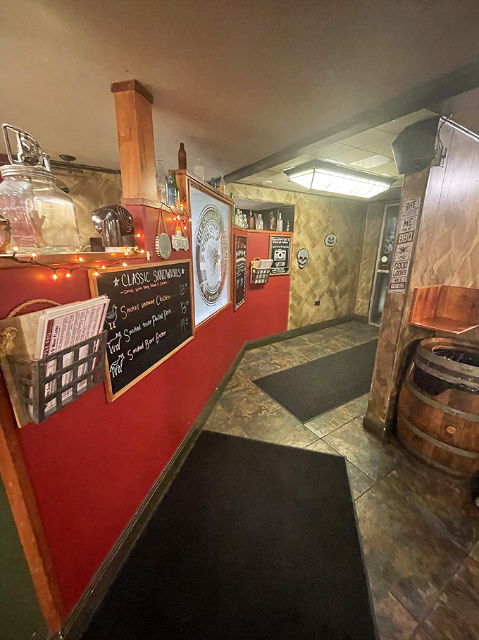 The corridor to carnivore nirvana, where red walls guide you like the flames that smoke their meats. That barrel isn't just decor&mdash;it's foreshadowing.