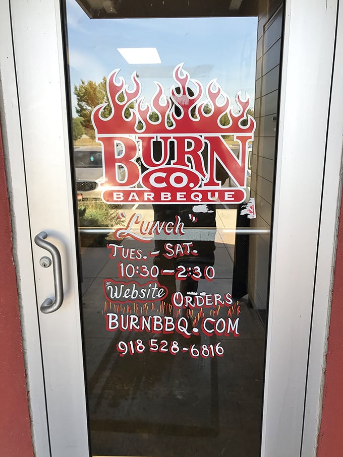 The flaming logo promises "Lunch" with hours that feel like a gentle warning: come early or miss out on meat that's worth rearranging your day for.