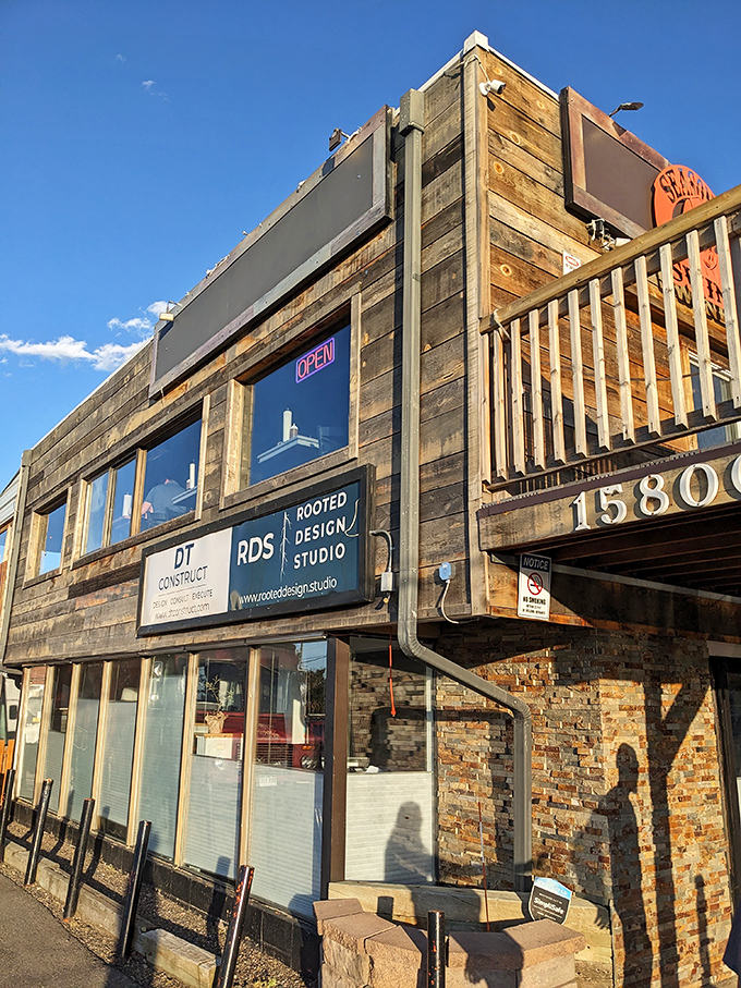The architectural equivalent of a mullet: business downstairs, party upstairs. This wooden facade has more character than most Netflix series.