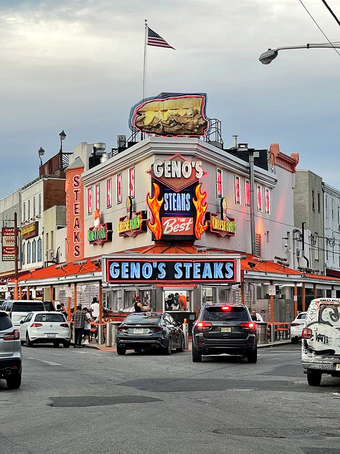 The American flag crowns this temple of cheese and beef, where the pursuit of happiness comes served on an Amoroso roll.
