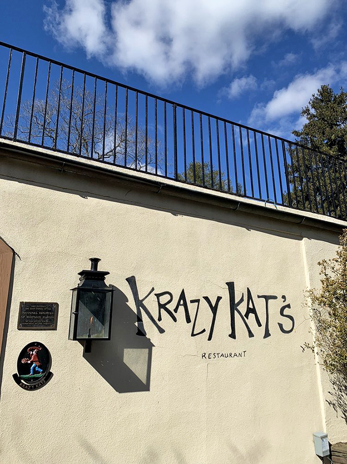 Another view of that instantly recognizable entrance. The playful typography against the cream-colored wall signals that ordinary dining experiences need not apply.