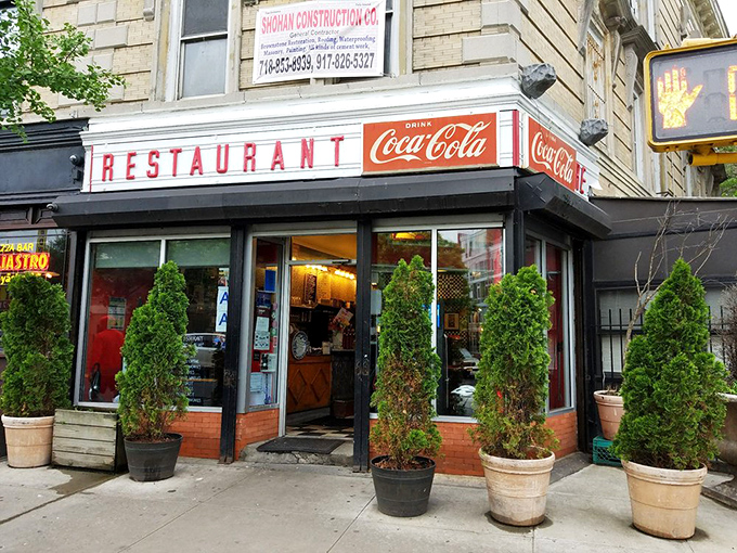 That corner entrance with its army of potted plants standing guard&mdash;Tom's Restaurant isn't just a building, it's a landmark where breakfast dreams come true.