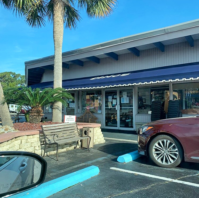 Palm trees stand guard outside this temple of breakfast, where hungry pilgrims make their morning journey for pancake salvation.
