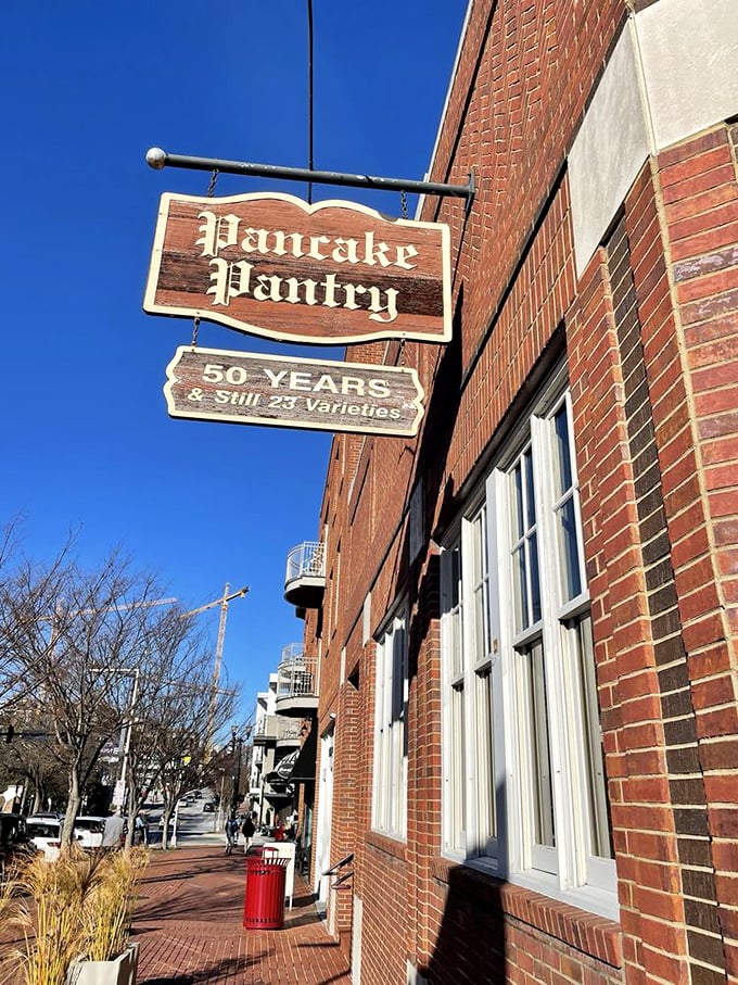 The Pancake Pantry's brick exterior stands sentinel on the corner, a breakfast landmark that's outlasted countless Nashville music careers and fashion trends.