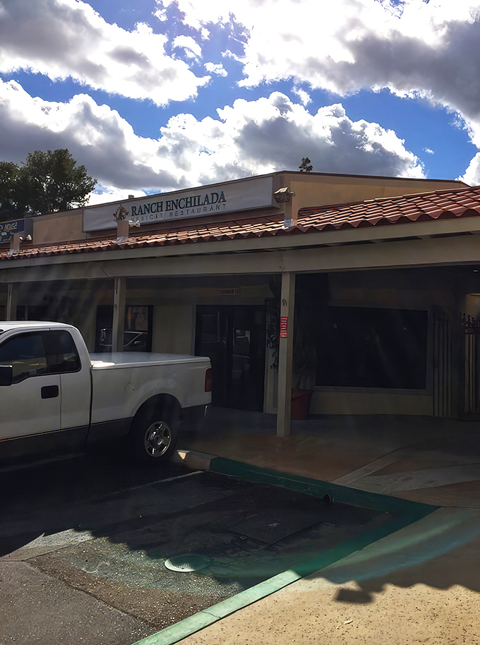 The restaurant stands ready to welcome hungry travelers. Under dramatic California clouds, Ranch Enchilada promises authentic flavors without the passport requirement.
