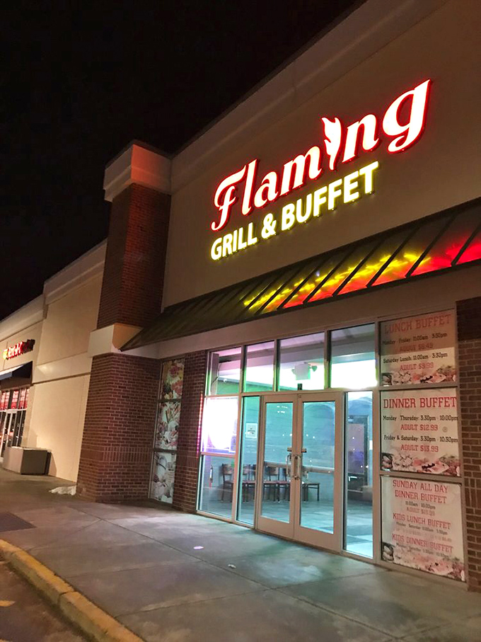 As darkness falls, the illuminated sign becomes a beacon for hungry travelers, promising unlimited deliciousness within its welcoming doors.