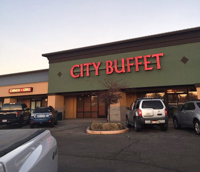 As dusk settles, City Buffet's sign glows like a beacon for the hungry masses seeking all-you-can-eat salvation.
