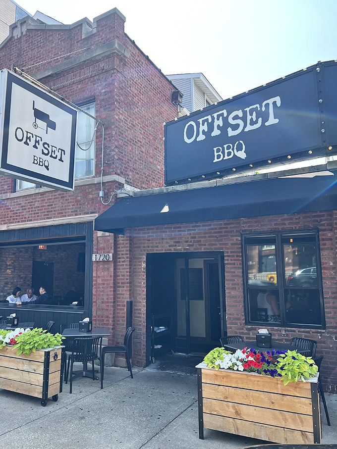 Daytime reveals Offset BBQ's charming exterior, where flower boxes welcome you to smoked meat paradise like friendly ushers.
