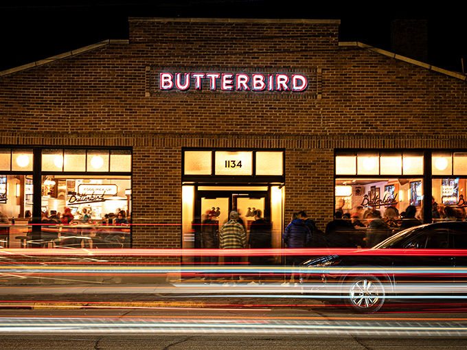 As night falls, Butterbird becomes a beacon of deliciousness. The neon sign glows with promise, drawing hungry pilgrims from across Madison.