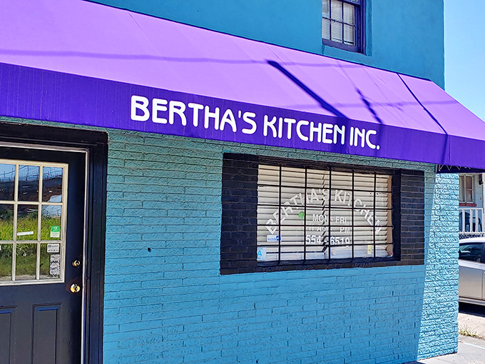 That purple awning against turquoise walls&mdash;as bold and unapologetic as the flavors waiting inside.