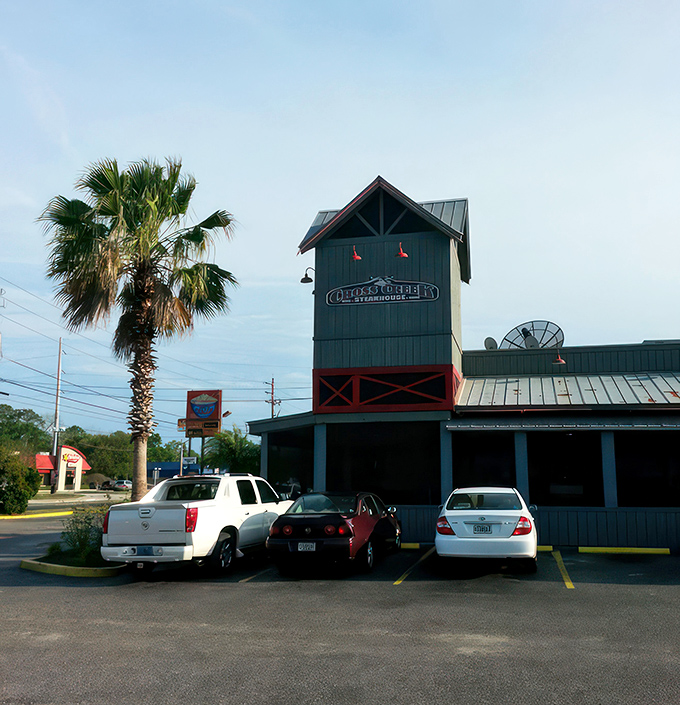 By daylight, Cross Creek's distinctive silhouette stands tall against Florida's blue skies, a landmark for hungry travelers and locals alike.