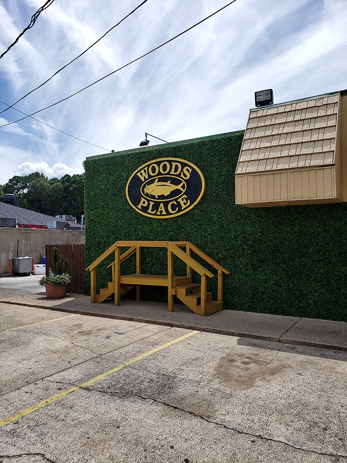 The artificial turf exterior wall with its golden Woods Place emblem &ndash; Camden's equivalent of a Michelin star for those in the know.