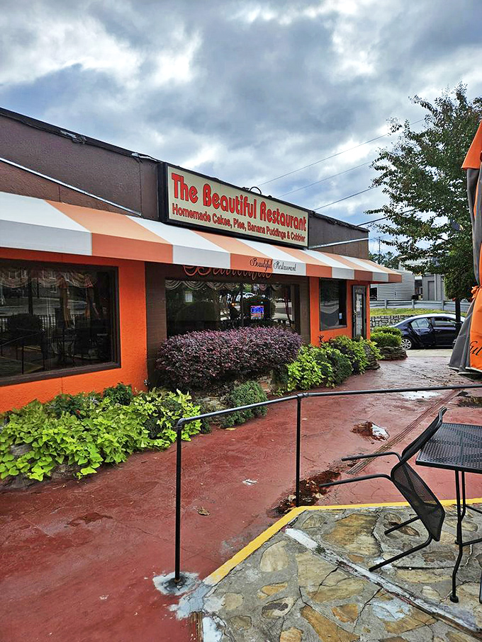 The exterior might be humble, but those orange awnings signal something special. Like a lighthouse for hungry souls in a sea of chain restaurants.