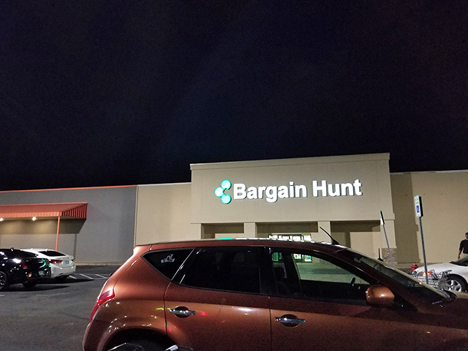 Even after dark, that illuminated teal sign serves as a beacon of hope for tomorrow's shopping adventures. Sleep tight, bargain dreams.