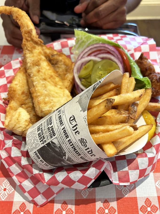 This fish sandwich doesn't just satisfy hunger&mdash;it conquers it. The newspaper-lined basket is both practical and a nod to seaside tradition.