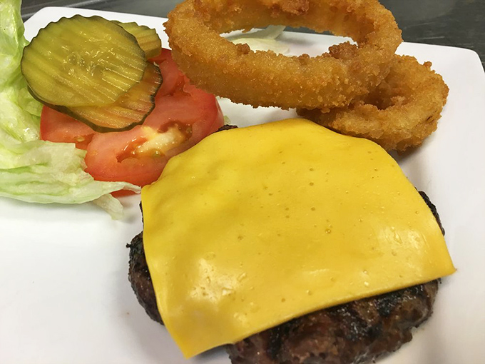 This isn't just a burger with cheese—it's an engineering marvel that requires both hands, several napkins, and absolutely no regrets.