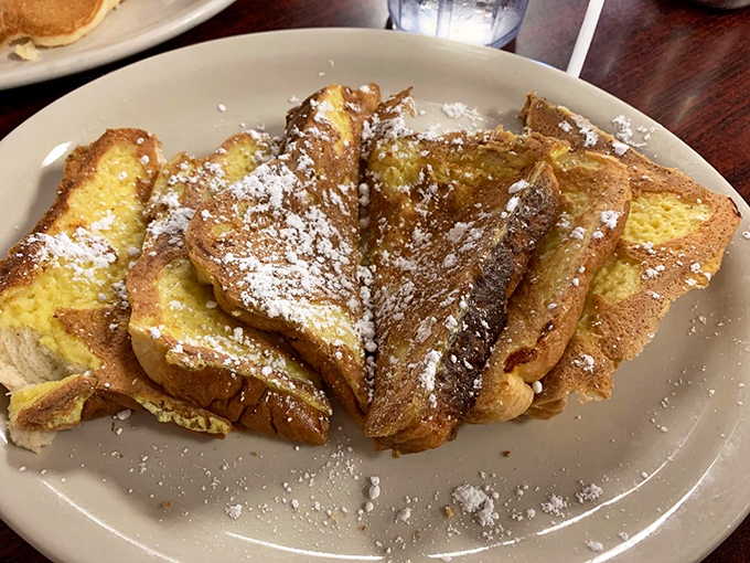French toast that's gone through the perfect egg bath spa treatment. That powdered sugar snow shower is the final touch of breakfast perfection.