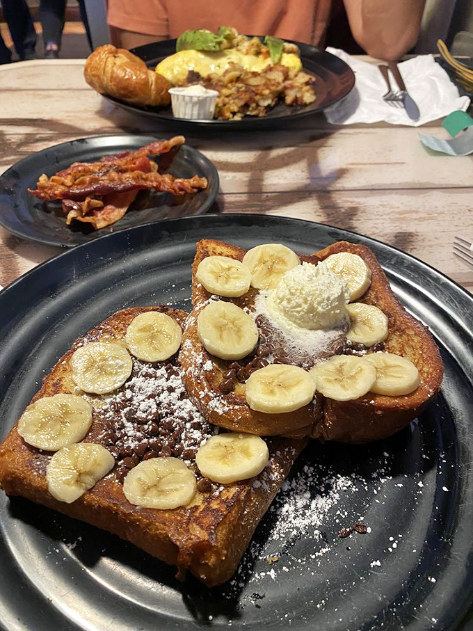 French toast that makes you forget all other French toast. Those bananas aren't just toppings&mdash;they're the supporting actors in a breakfast blockbuster.
