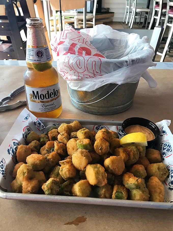 Crispy fried okra and dipping sauce prove that Krab Kingz excels beyond seafood, offering Southern comfort alongside oceanic treasures.