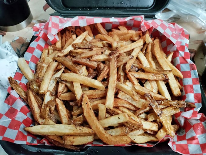 Hand-cut fries with personality—each one seemingly volunteering to be the perfect vehicle for sopping up that last bit of sauce.