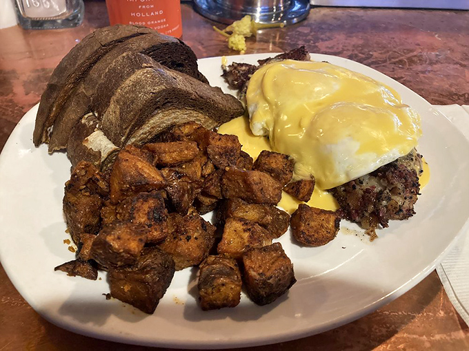 The Goat Hash Special in all its glory&mdash;crispy potatoes, savory meat, and hollandaise that flows like a yellow river of dreams.