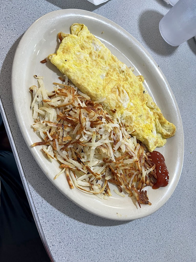 An omelet that knows its supporting actor&mdash;those hash browns&mdash;deserves equal billing. Simple, unpretentious breakfast perfection that makes avocado toast look like a passing fad.