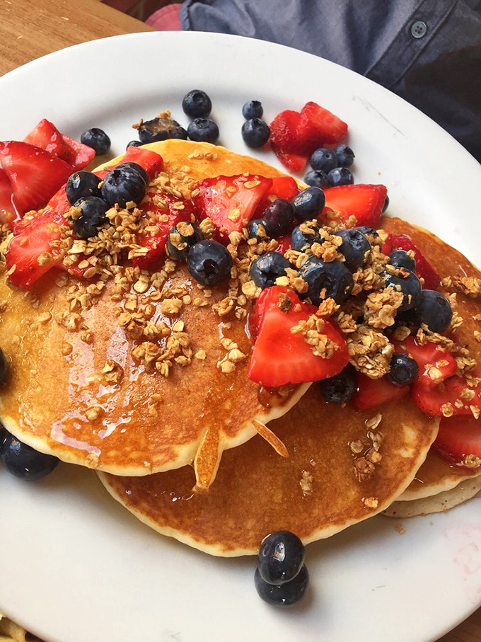 Pancakes that make you feel virtuous while indulging. Those fresh berries and granola transform breakfast into an Instagram-worthy masterpiece that actually tastes as good as it looks.