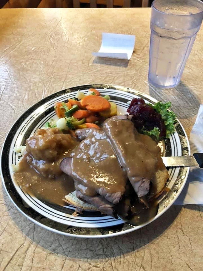 The wooden counter and open kitchen layout invite you to watch breakfast magic happen&mdash;where coffee flows and pancakes flip with practiced ease.