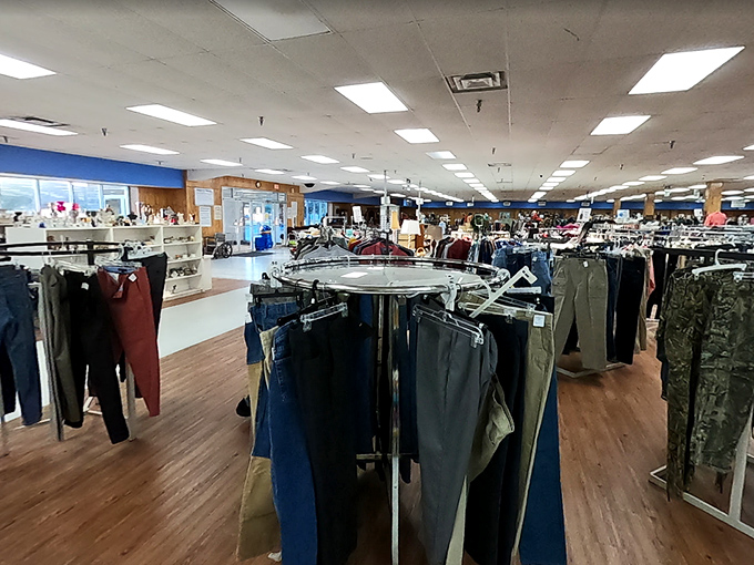 Racks of carefully organized pants stretch toward the horizon—proof that in the thrift store universe, your size always exists somewhere.