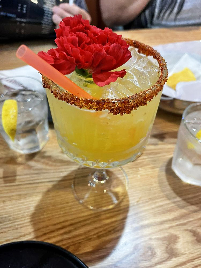 A margarita that doesn't mess around&mdash;rimmed with chile salt and crowned with a carnation. It's not just a drink; it's jewelry you can consume.