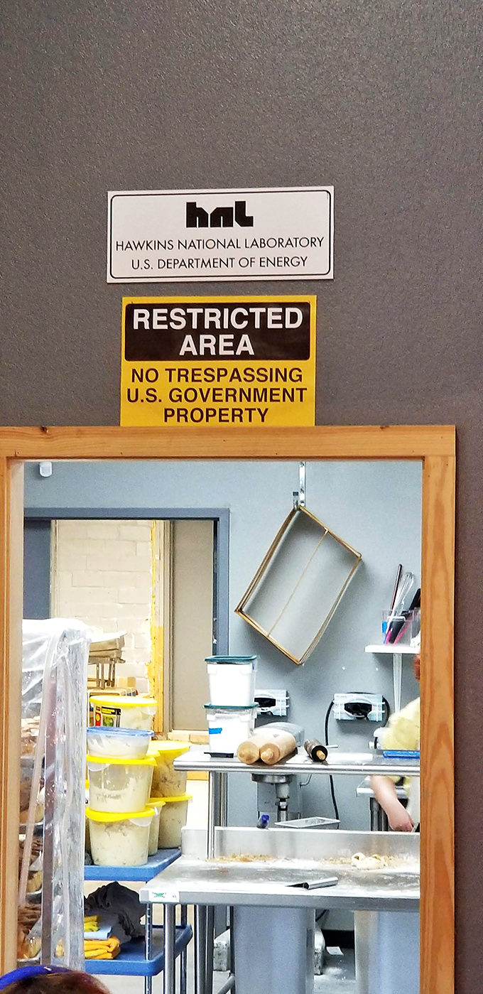 Behind this playful "Restricted Area" sign lies the top-secret laboratory where ordinary ingredients transform into extraordinary treats through the alchemy of baking.