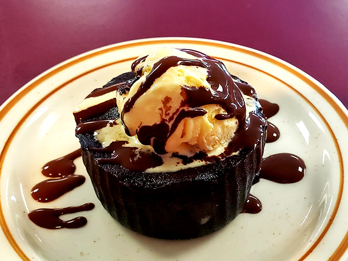 This isn't just chocolate cake&mdash;it's a warm lava cake with ice cream performing a beautiful melt, creating the dessert equivalent of a standing ovation.