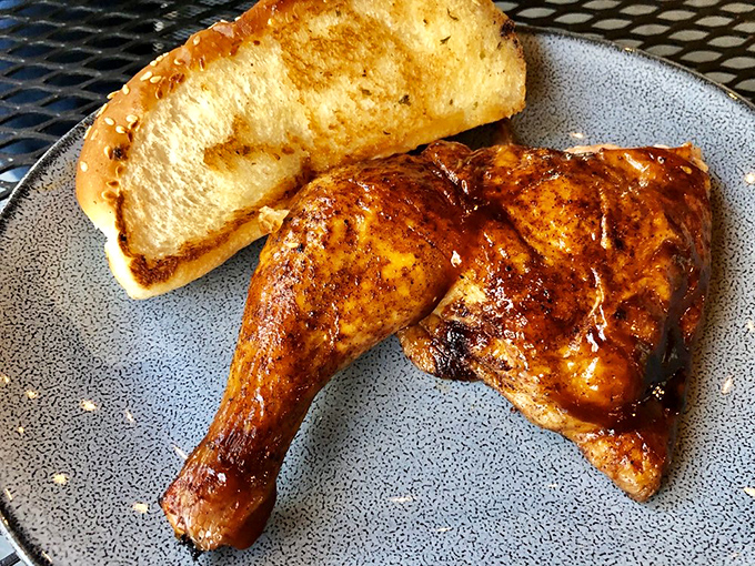 This chicken quarter has clearly been to finishing school—perfectly bronzed, properly sauced, and ready to make your acquaintance. The Texas toast is just showing off.