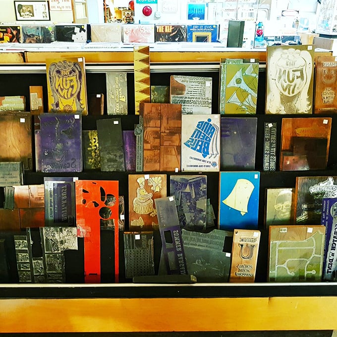 Letterpress blocks that once printed America's stories. Before digital design, creating text was a physical art form requiring muscle and precision.