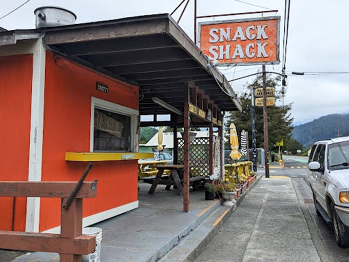 The Snack Shack's bright orange exterior promises simple pleasures after a day of grand adventures among the giants.