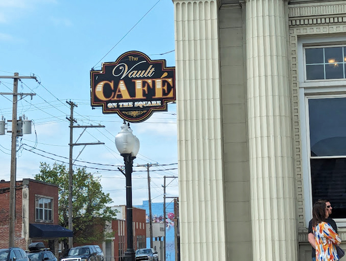 The Vault Café's sign promises what every great small-town eatery delivers: comfort food served with a side of local gossip and genuine hospitality.